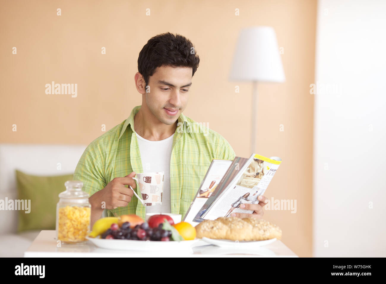 Indian man eating breakfast hi-res stock photography and images - Alamy