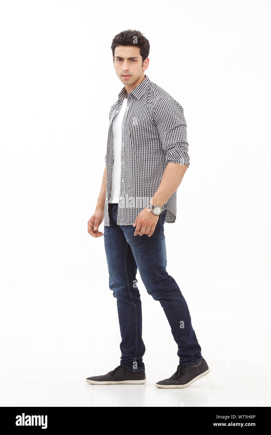 Young man walking Stock Photo - Alamy