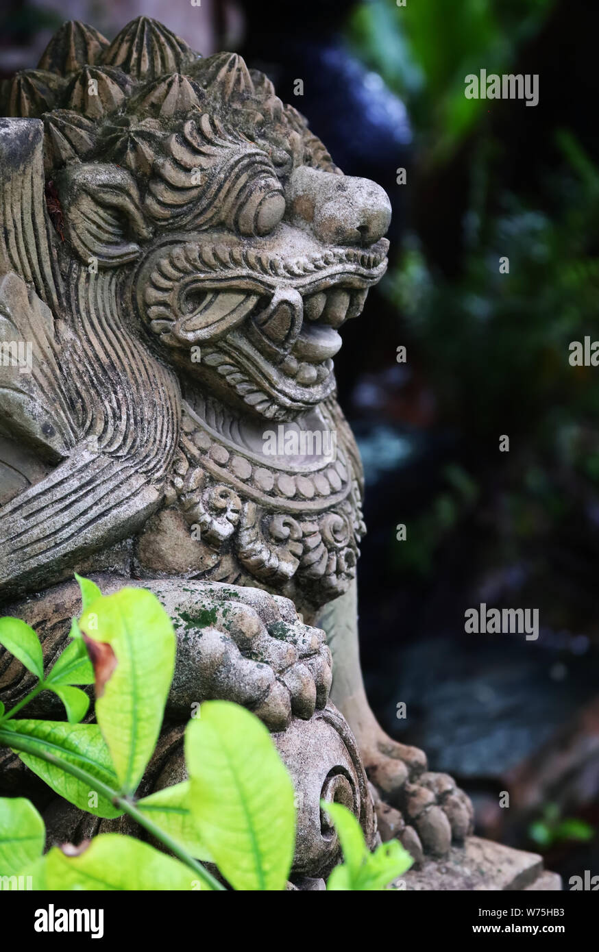 The lion statue in Bali style Stock Photo - Alamy