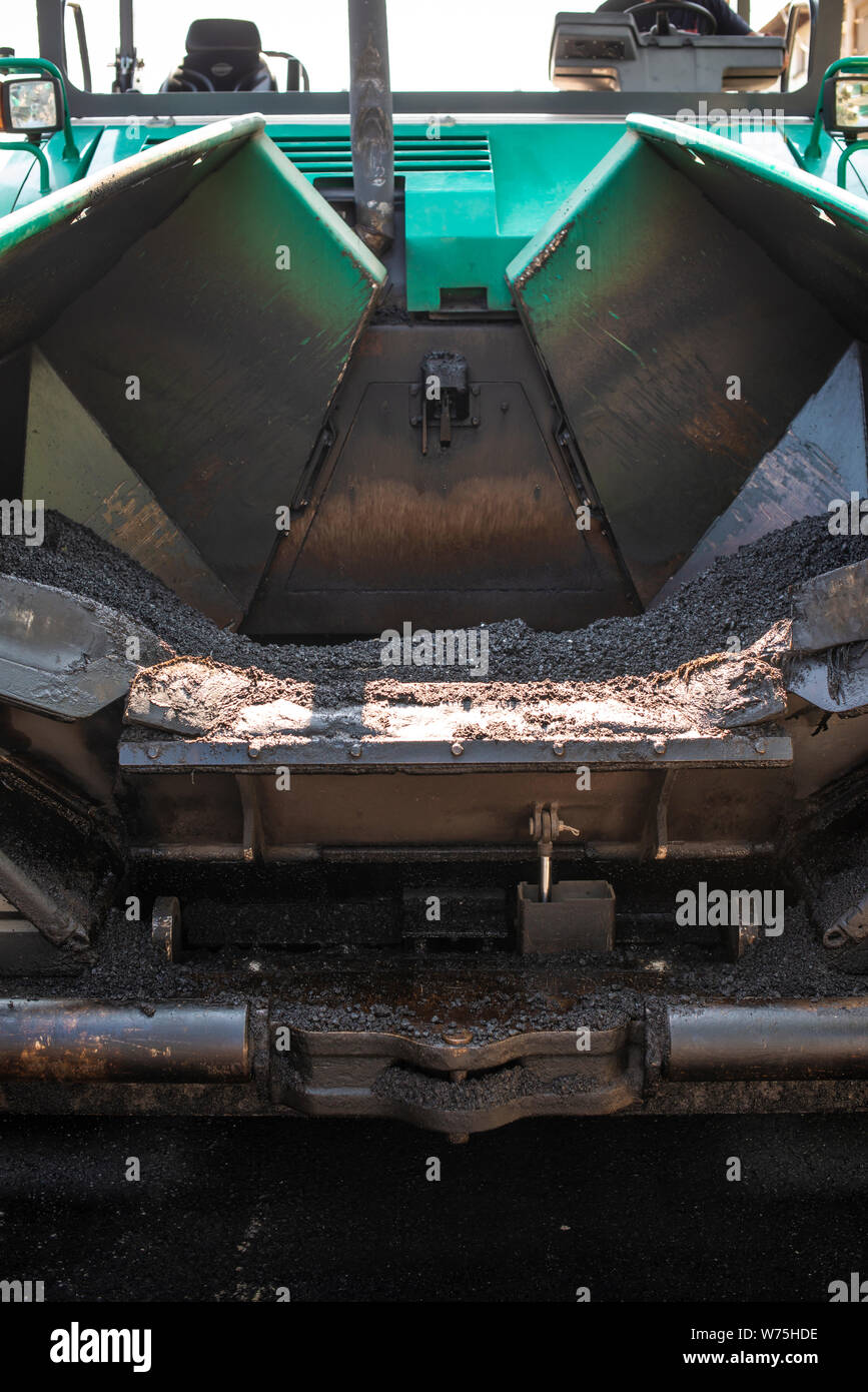 Asphalting machine on the road. Close up Stock Photo - Alamy