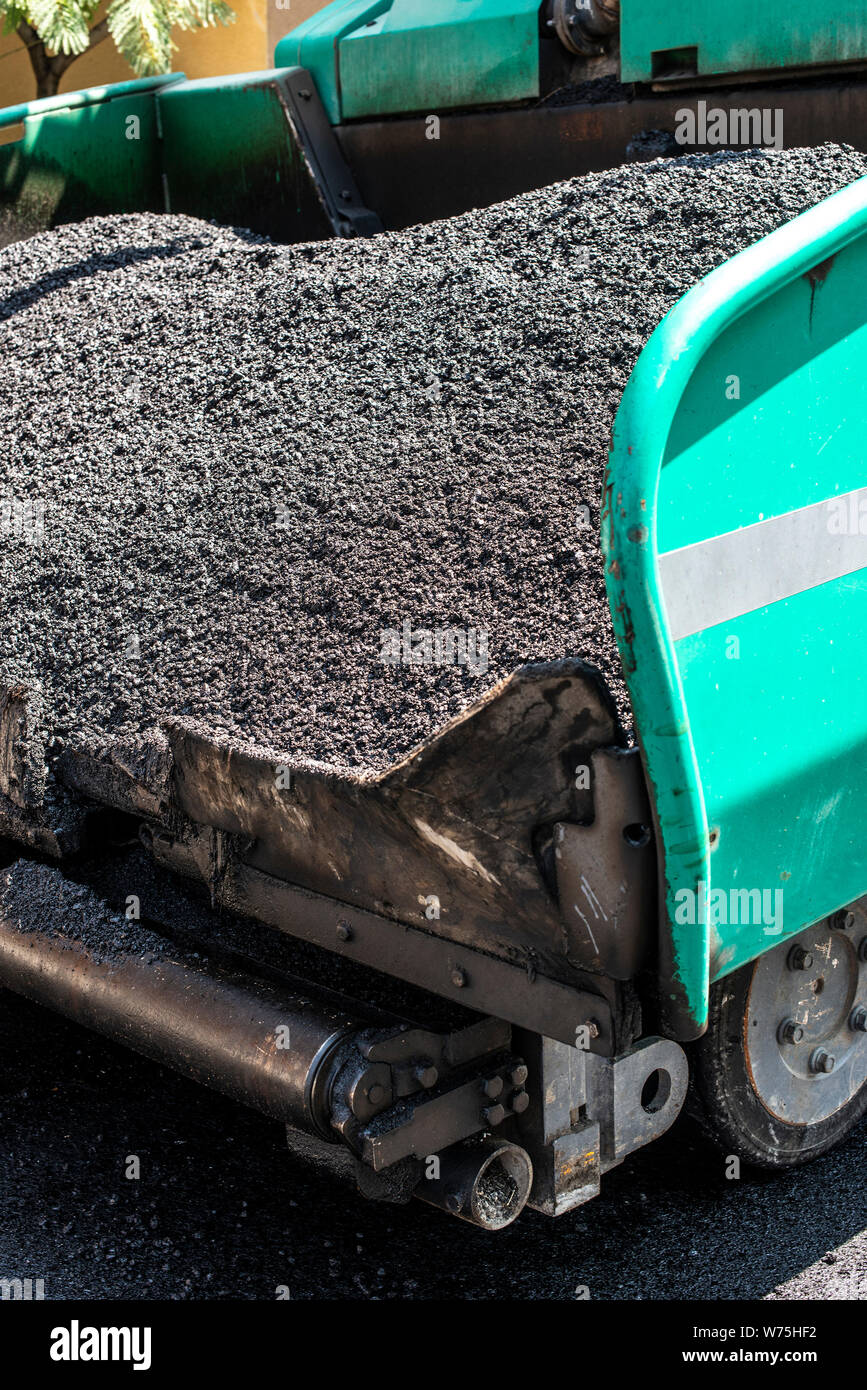 Asphalting machine on the road. Close up Stock Photo - Alamy