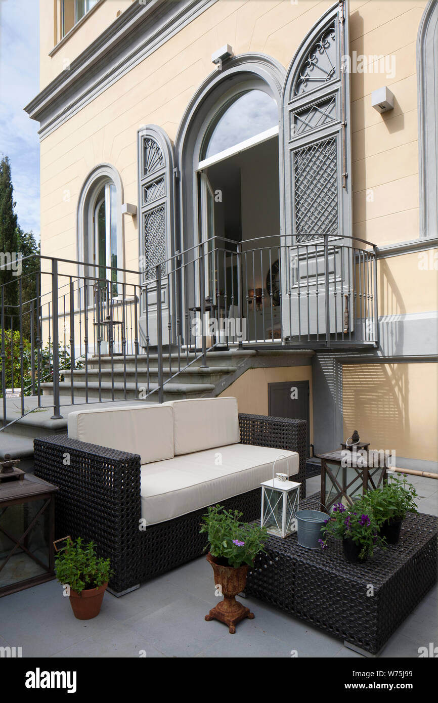 Elegant entrance in a beautiful villa in Milan with some plants and ...