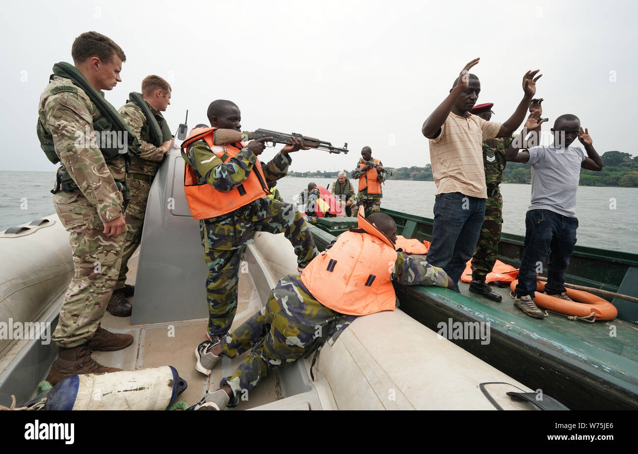 Royal Marines work alongisde soldiers from the Ugandan Army during a ...