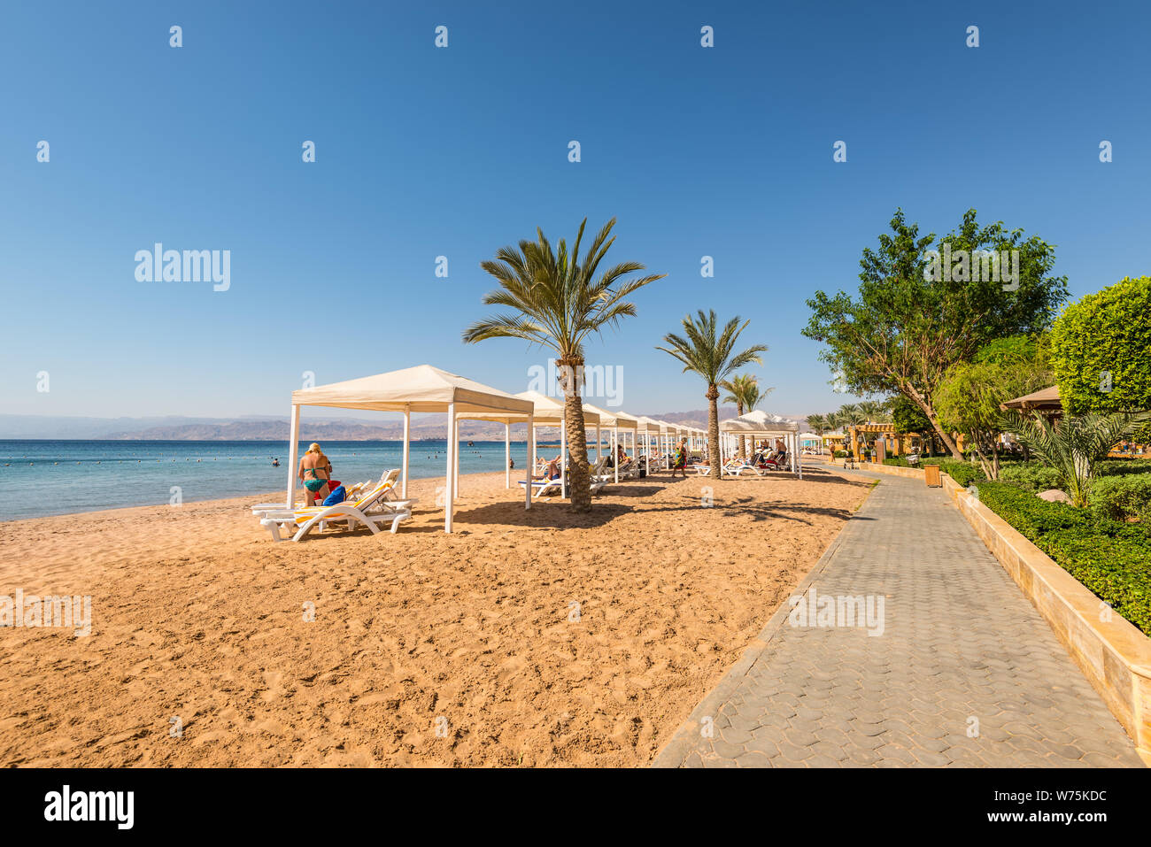 Aqaba, Jordan - November 6, 2017: People relaxing on the beach on the ...