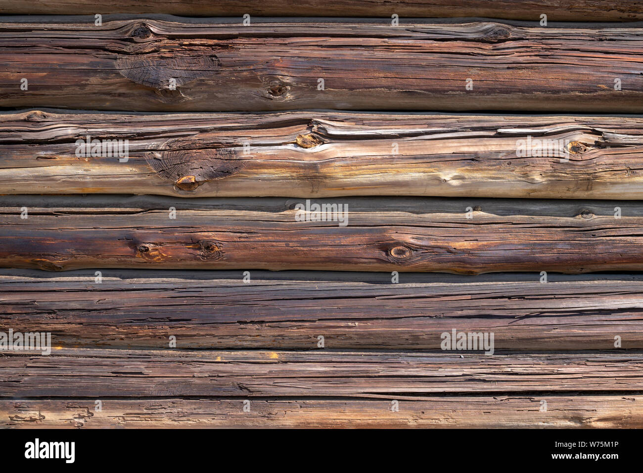 Background texture of old weathered wood cladding on a wall with ...