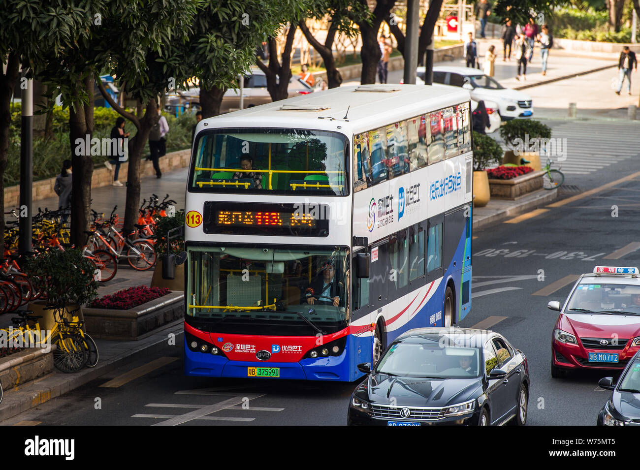 --FILE--A BYD electric double-decker bus travels on a road in Shenzhen ...