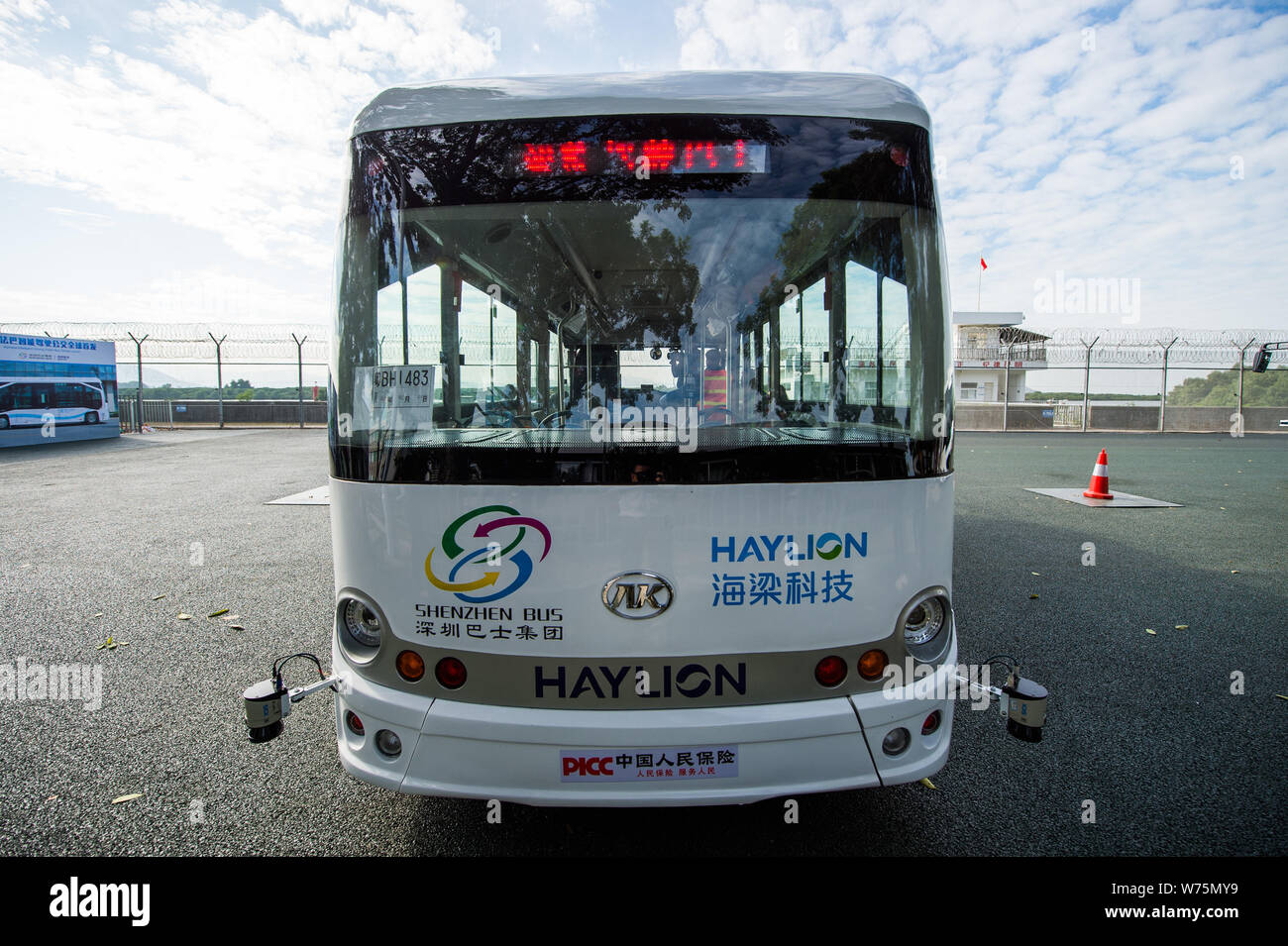 A self-driving bus is pictured on a street during trial operations in ...