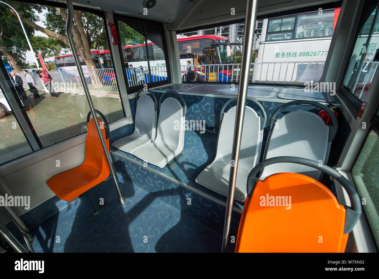 Interior view of a self-driving bus on a street during trial operations ...