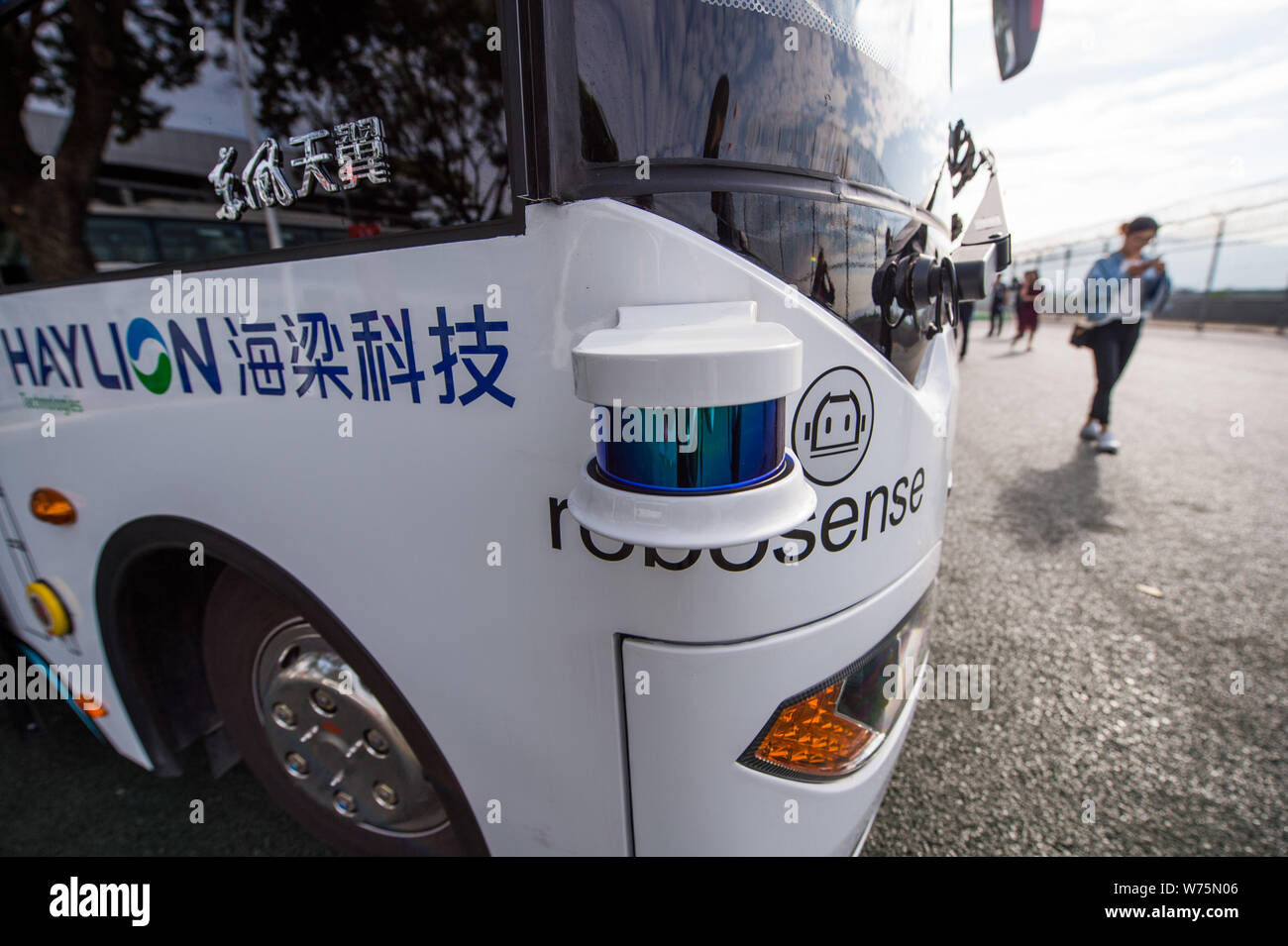Details of a self-driving bus on a street during trial operations in ...