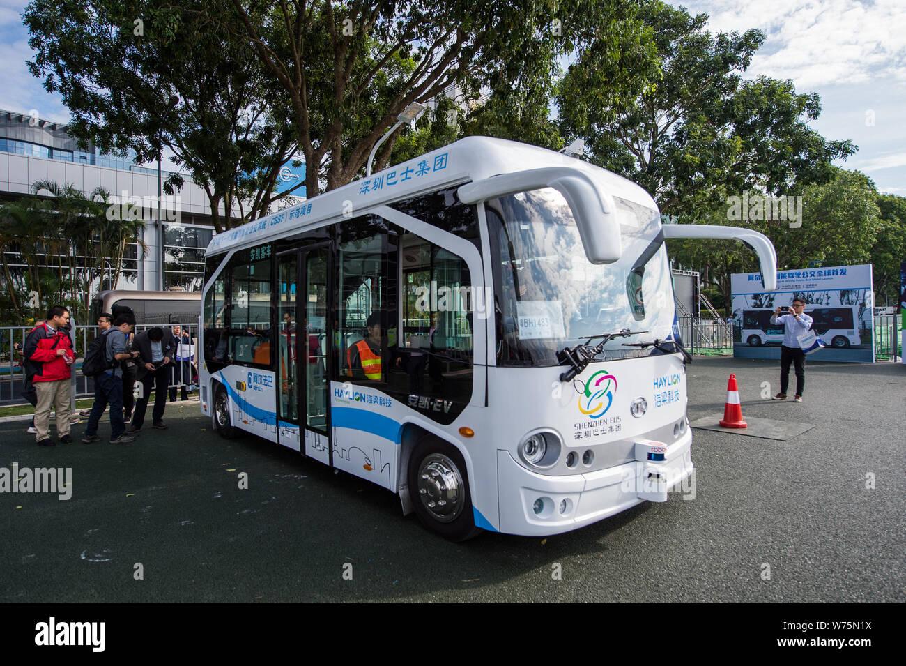 A self-driving bus is pictured on a street during trial operations in ...
