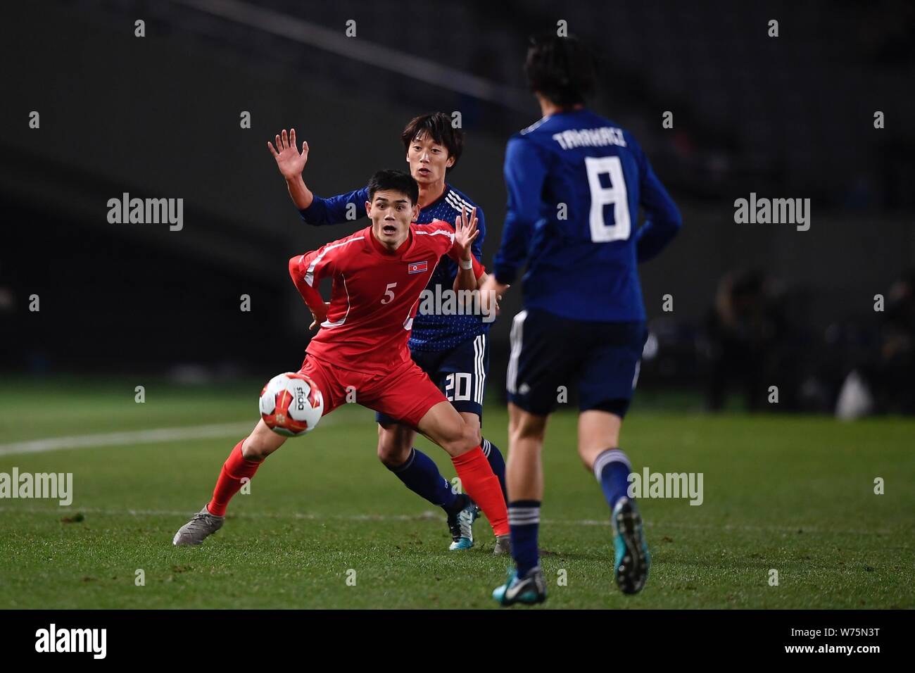 Sei Muroya of Japan, back, challenges Ri Un Chol of North Korean during ...