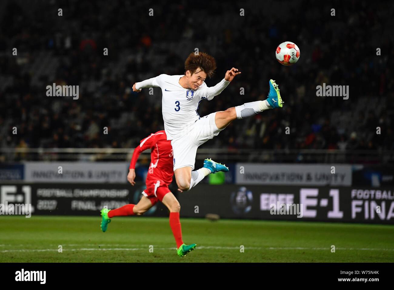 Kim Jinsu of South Korea kicks the ball to make a shoot against North ...