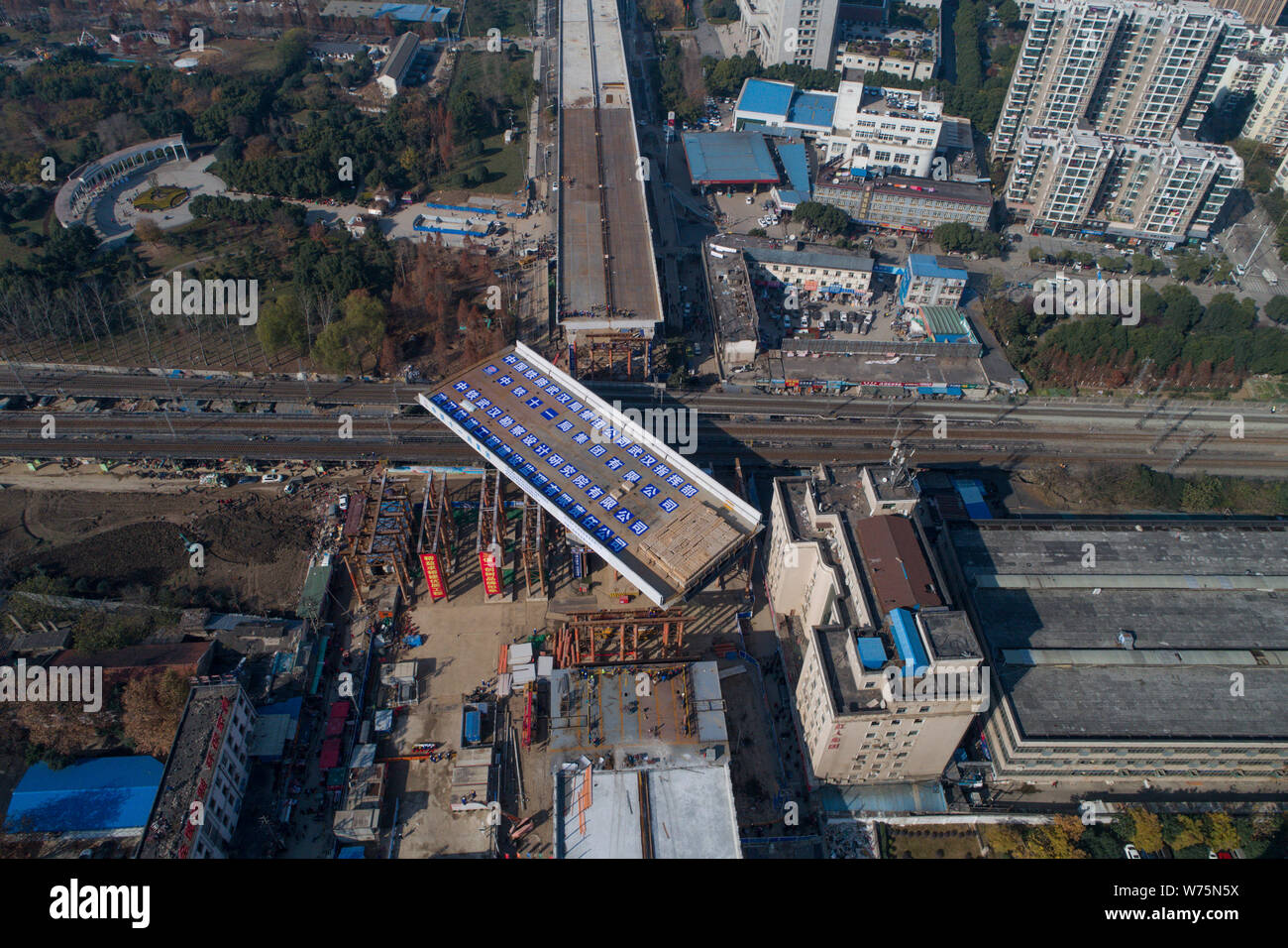 A box girder bridge rotates clockwise over a railway to dock with the ...