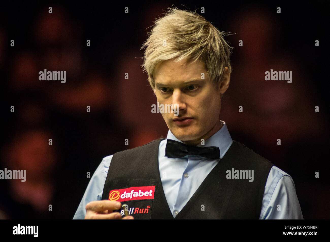 Neil Robertson of Australia considers a shot to Cao Yupeng of China in ...