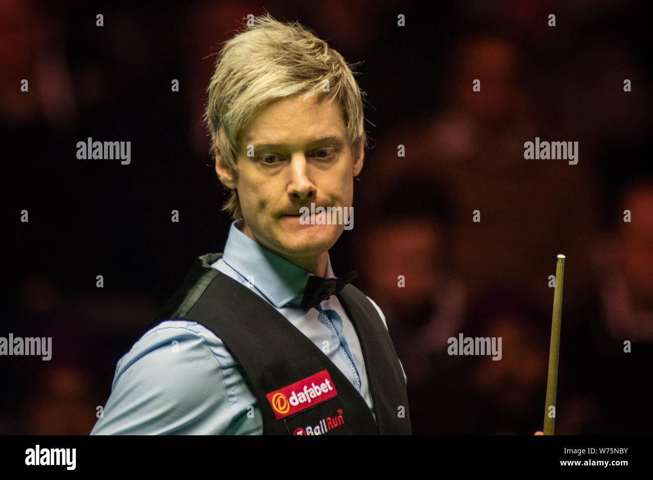 Neil Robertson of Australia considers a shot to Cao Yupeng of China in ...