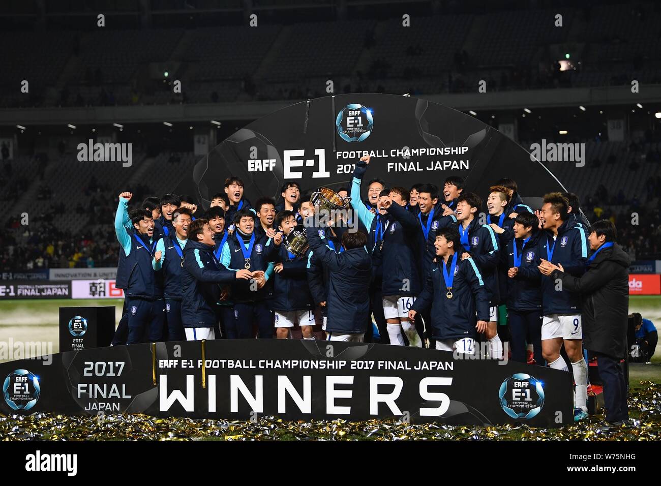 Players of South Korea pose on the podium after defeating Japan during the men's match of the ...