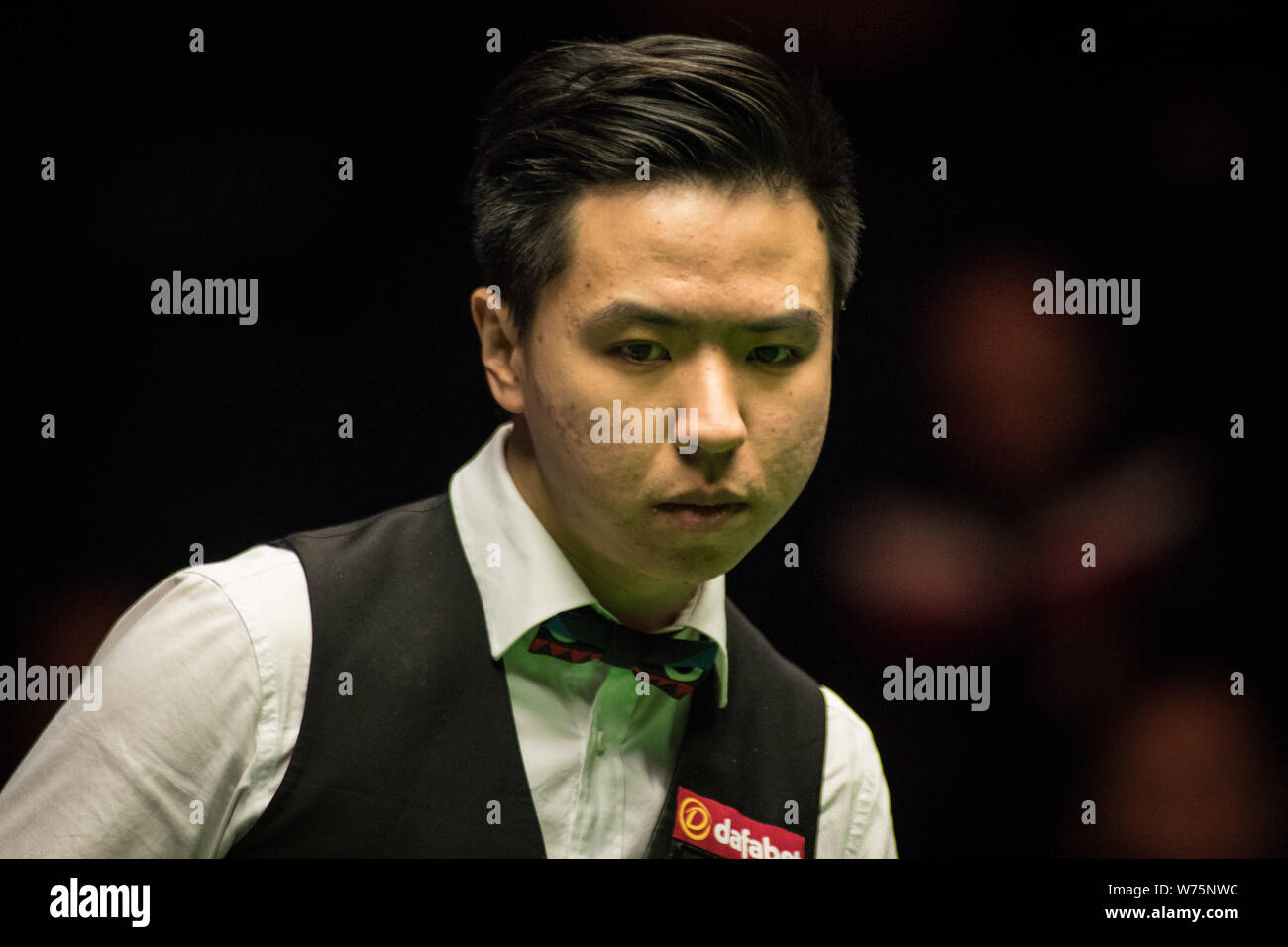 Xiao Guodong of China plays a shot to Neil Robertson of Australia in ...