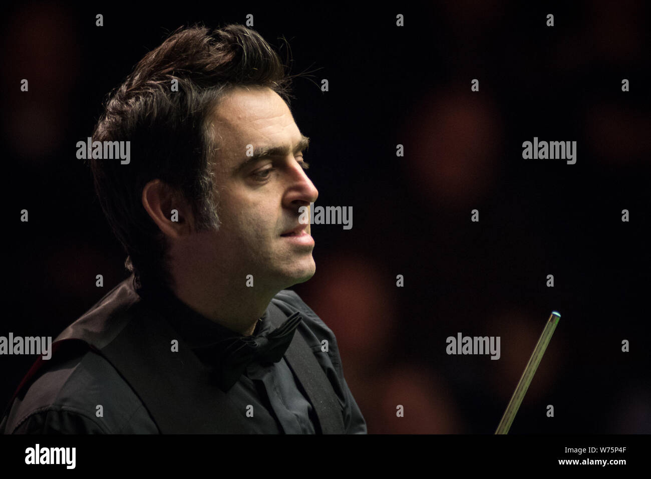 Ronnie O'Sullivan of England considers a shot to Michael Georgiou of Cyprus in their first round ...