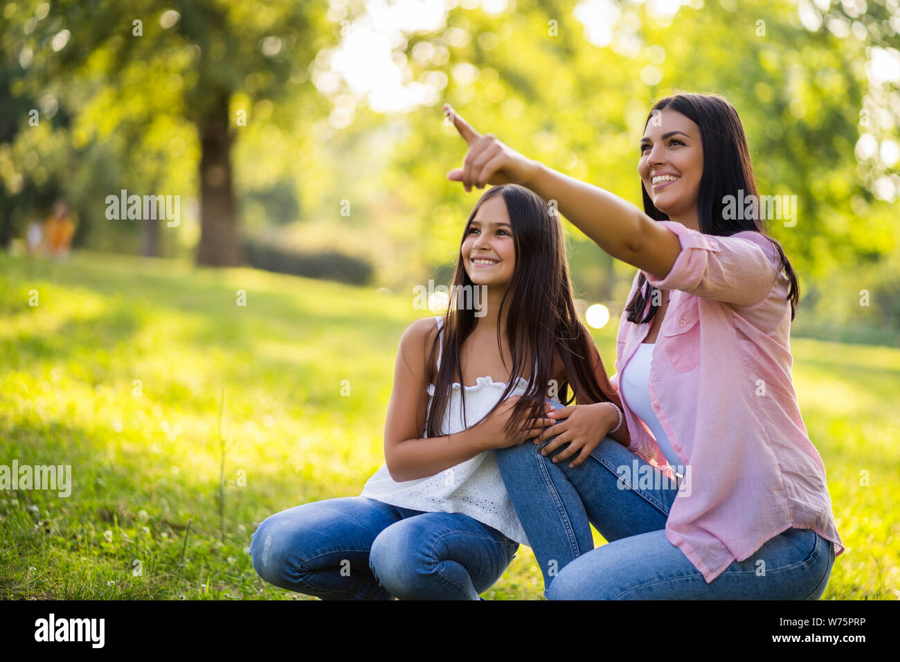 Happy family having nice time in park together Stock Photo - Alamy