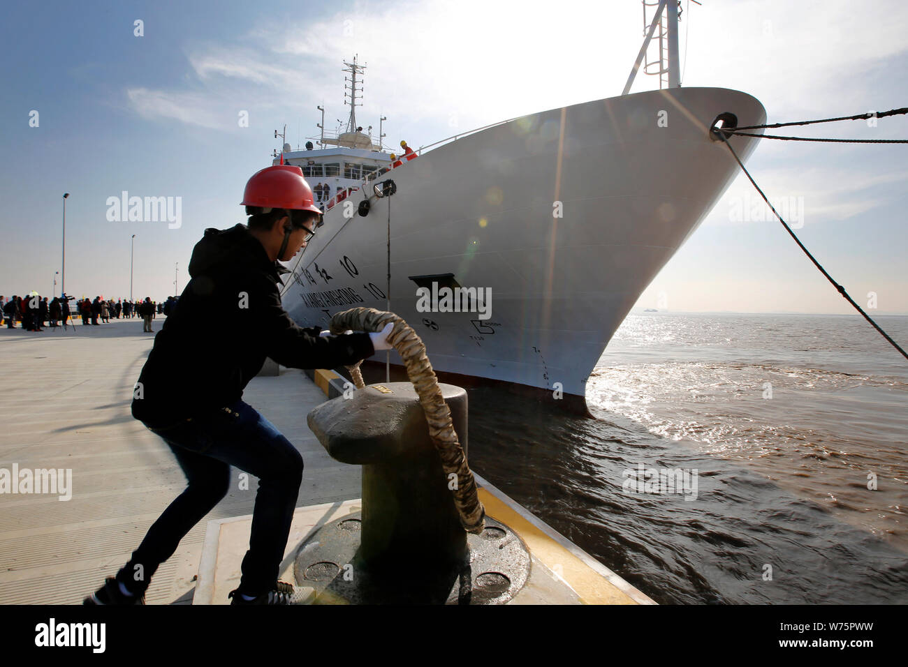 Chinese workers labor at Chinese oceanographic ship "Xiangyanghong 10 ...
