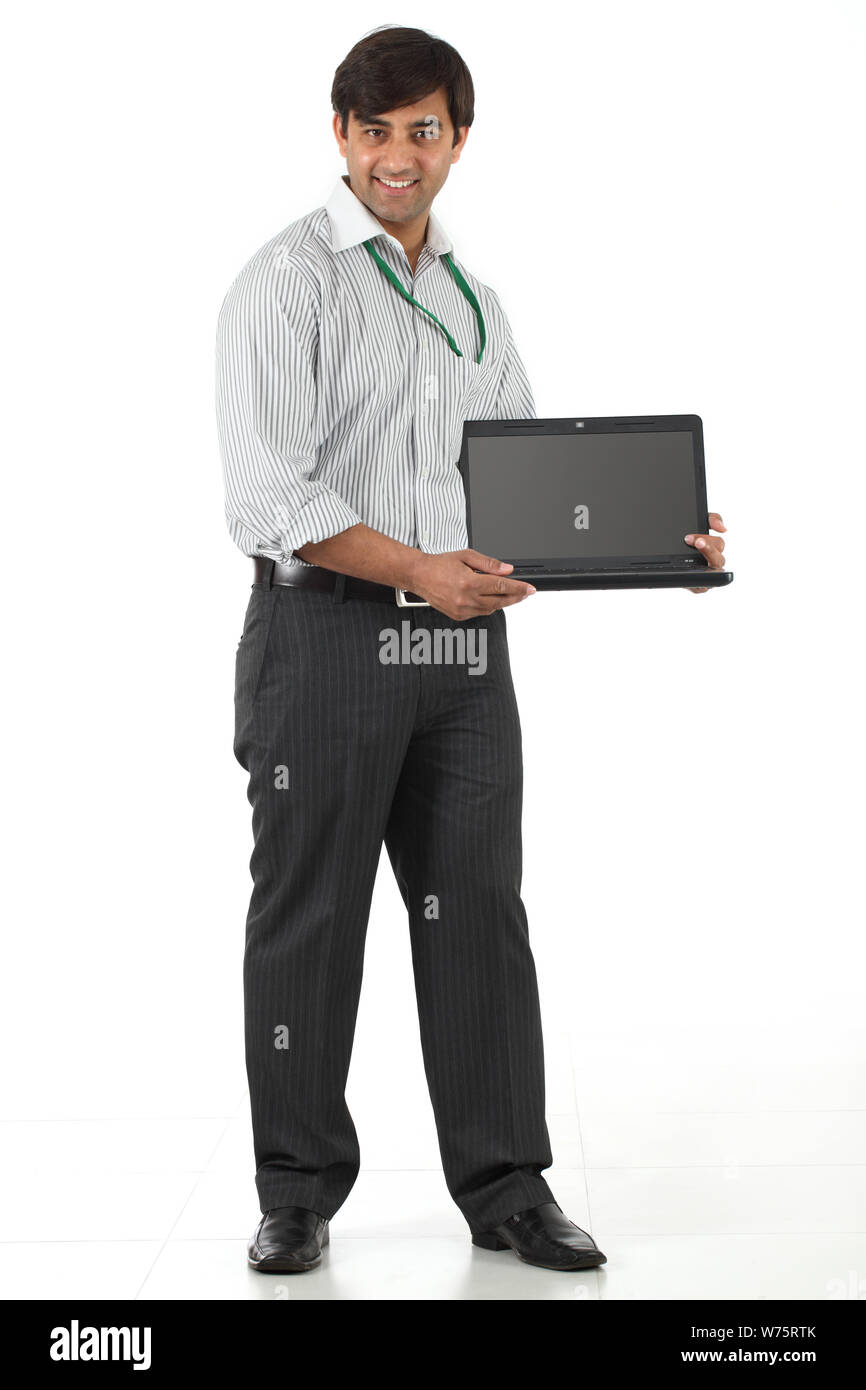 Salesman showing a laptop Stock Photo - Alamy