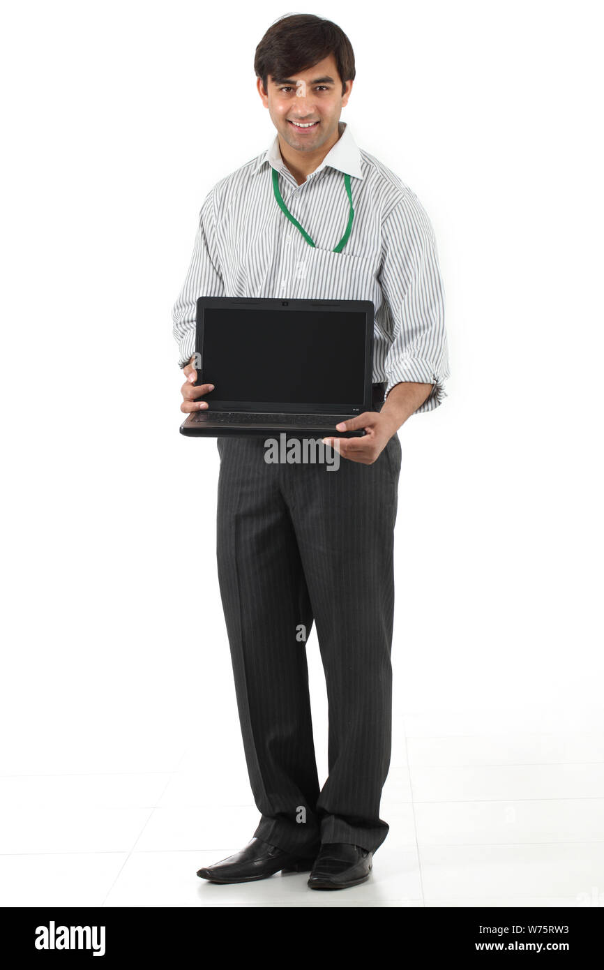 Salesman showing a laptop Stock Photo - Alamy