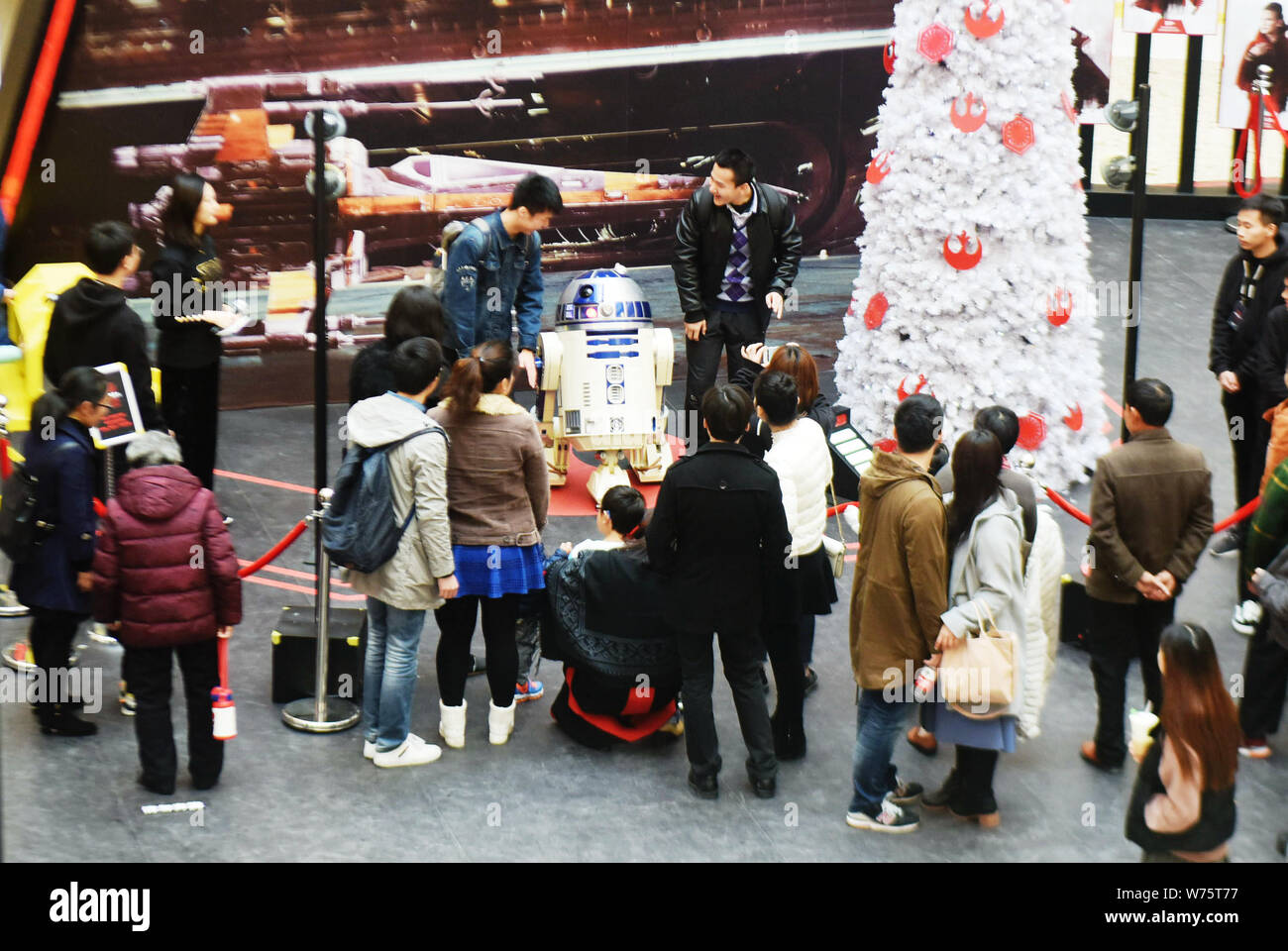 Customers look at a 0.96-meter-high model of Star Wars character ...