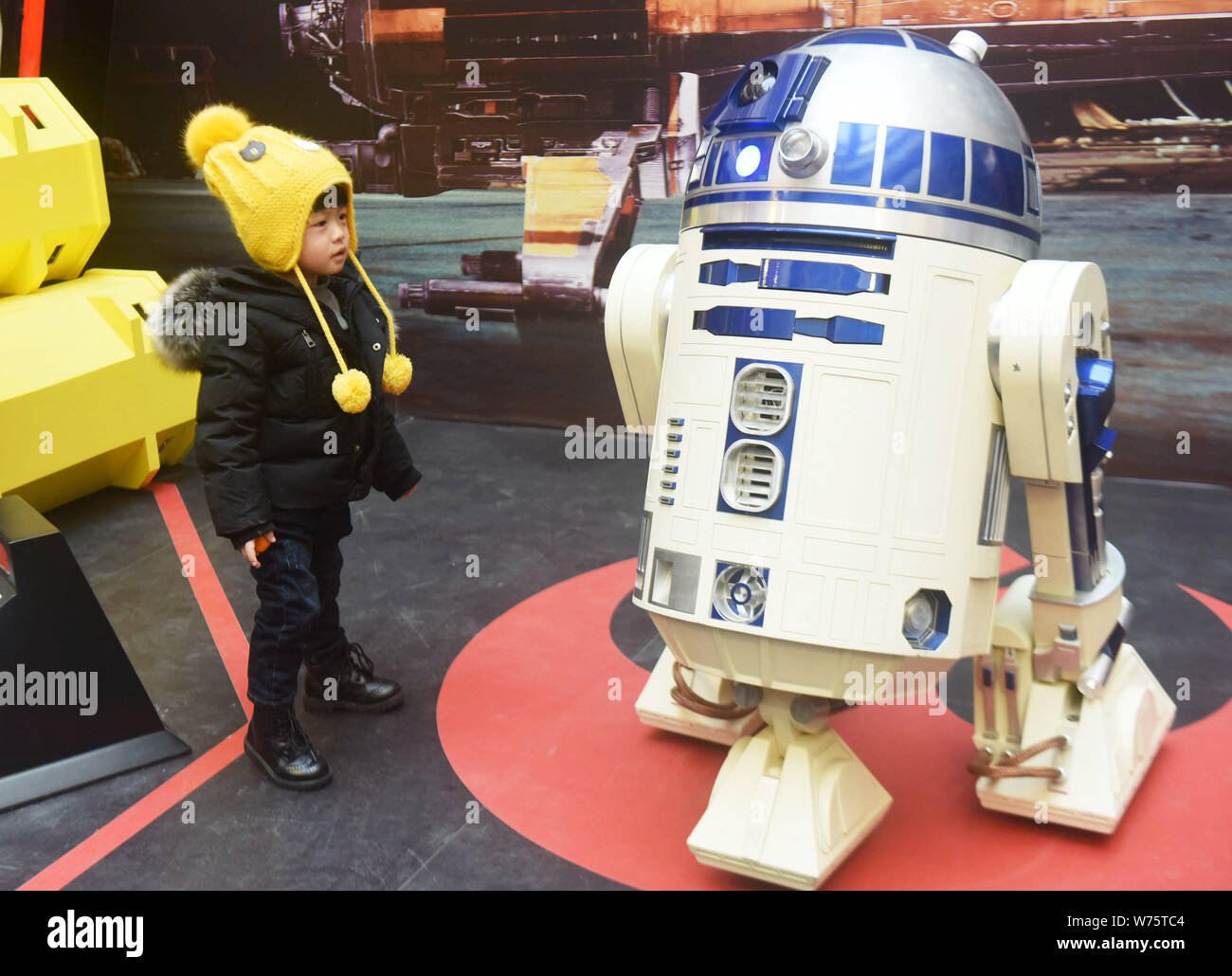 A child looks at a 0.96-meter-high model of Star Wars character ...