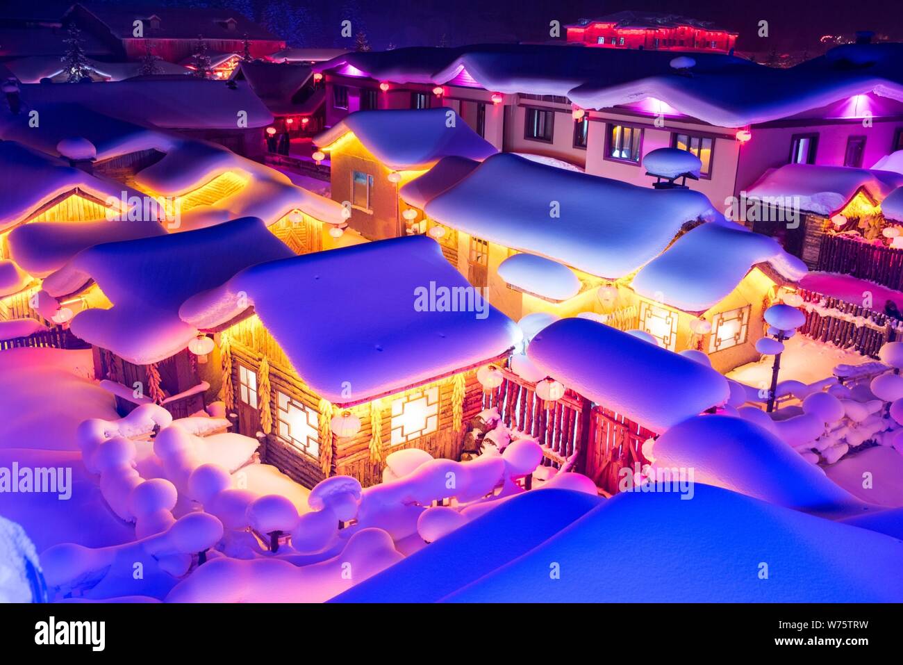 Scenery of illuminated houses in the tourist resort of Xuexiang Village ...
