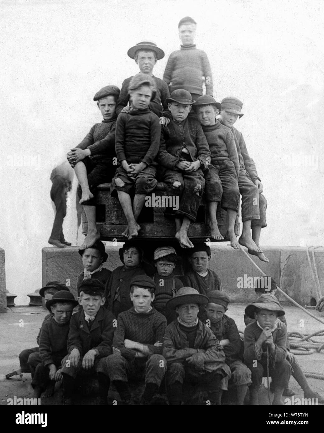Children palying on quayside capstan Stock Photo - Alamy