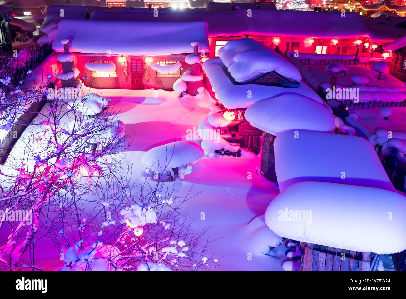 Scenery of illuminated houses in the tourist resort of Xuexiang Village ...