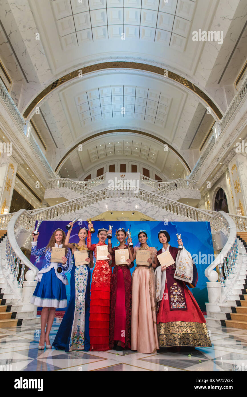 Contestants pose with their trophies during the 11th Asian Supermodel ...