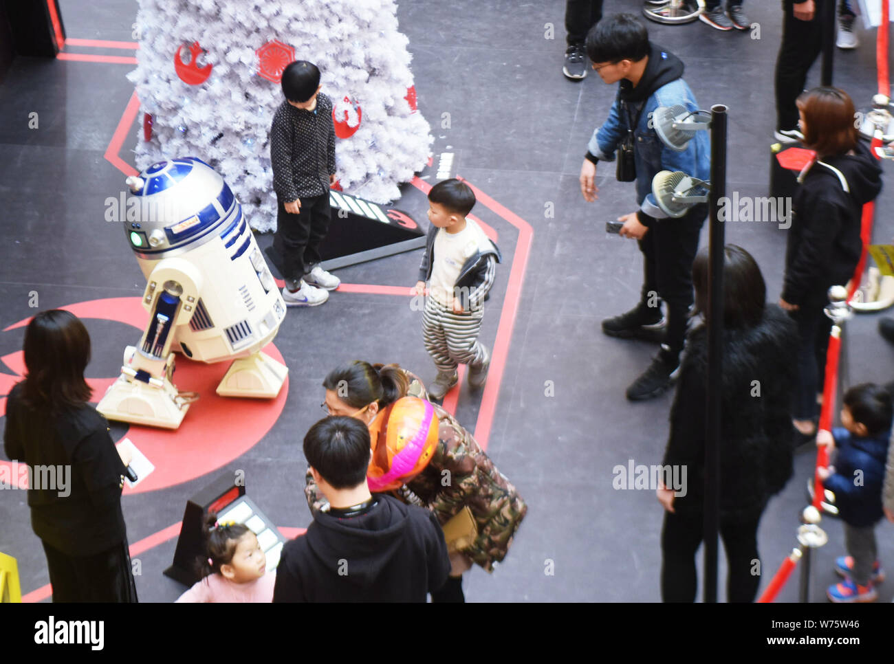 Customers look at a 0.96-meter-high model of Star Wars character ...