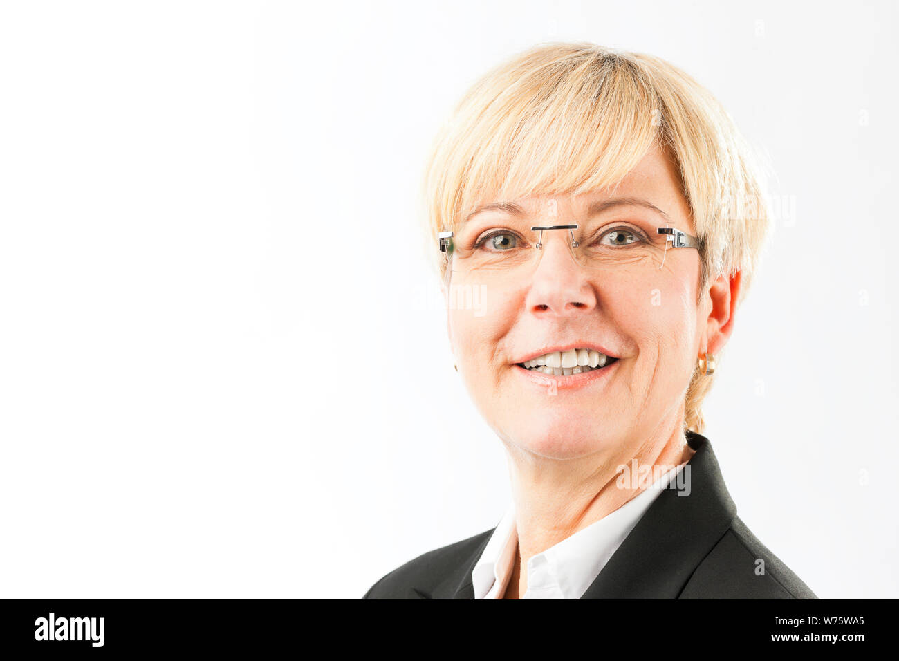 Older woman wearing spectacles hi-res stock photography and images - Alamy