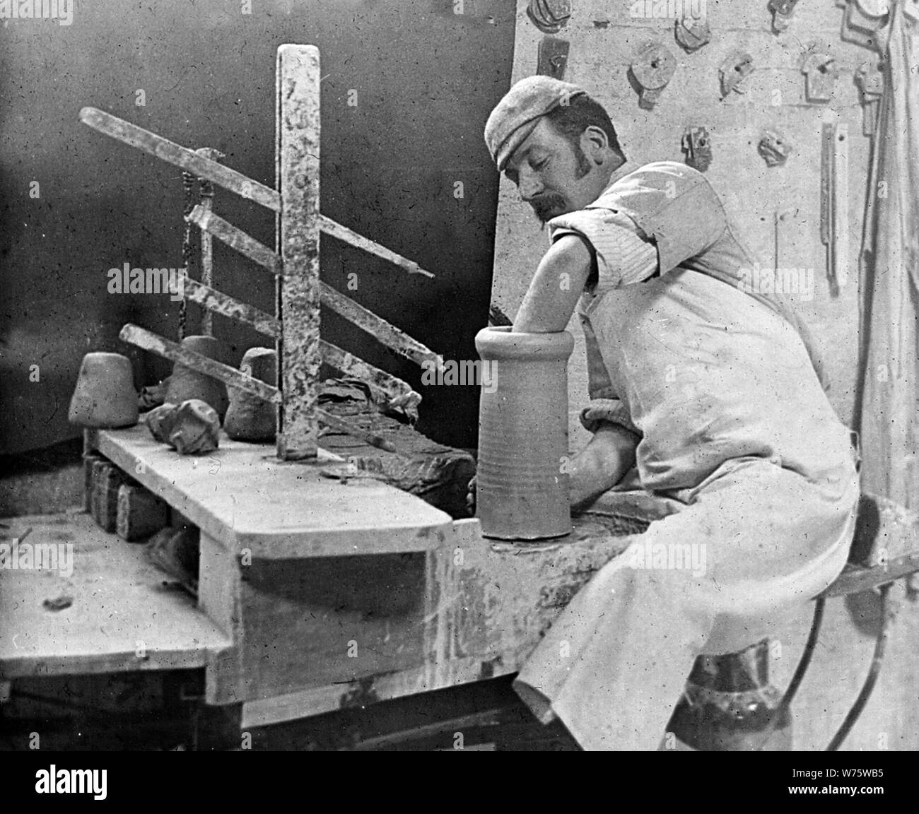 Throwing a pot on a wheel in a pottery factory Stock Photo - Alamy