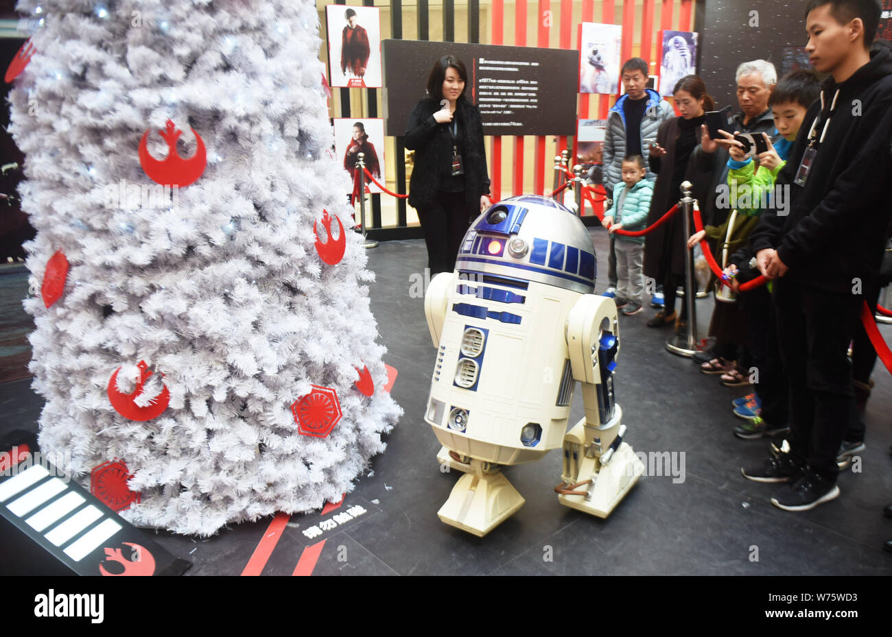 Customers look at a 0.96-meter-high model of Star Wars character ...