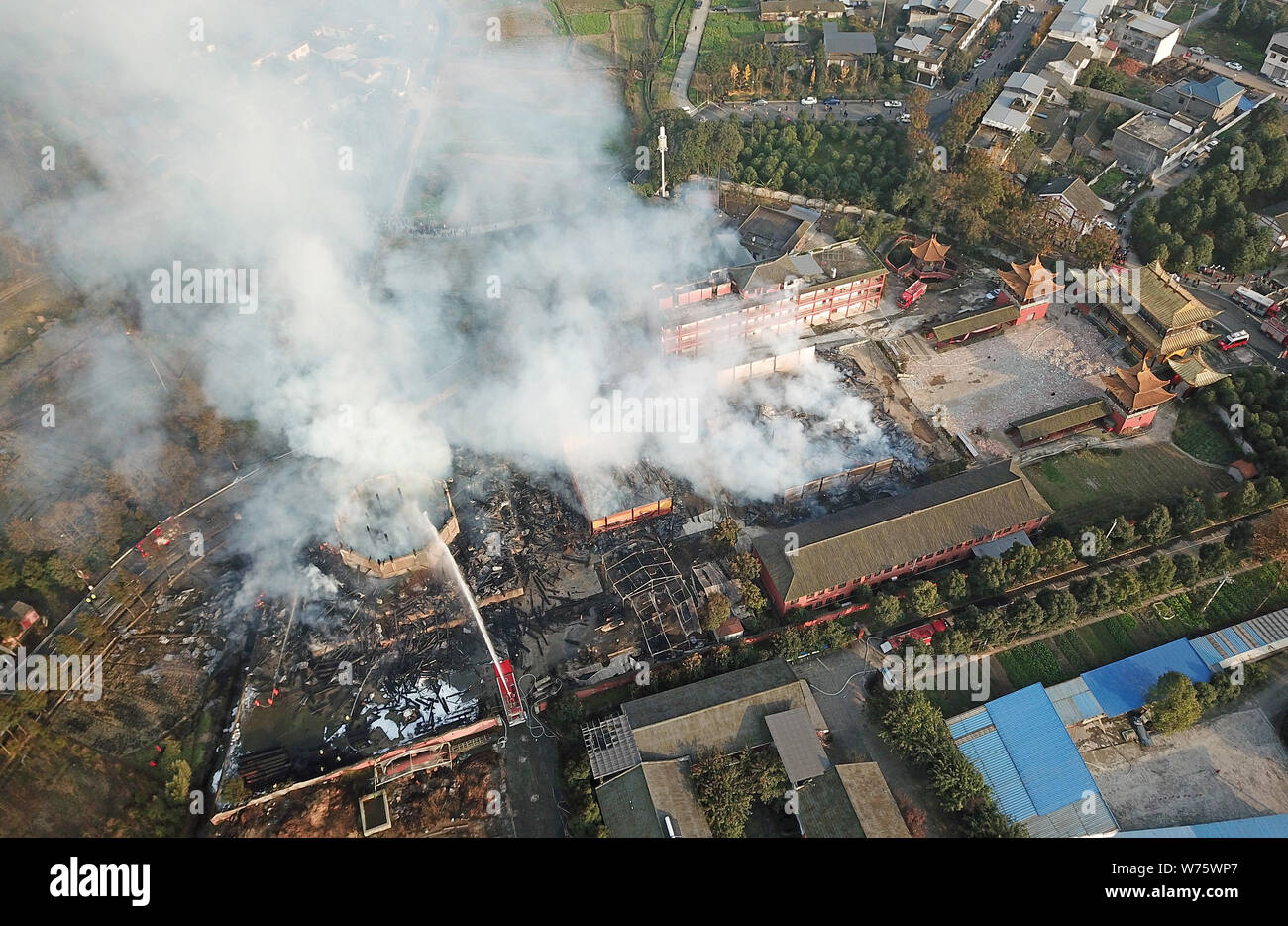 Aerial view of Asia's tallest wood pagoda burnt in fire at Jiulong ...