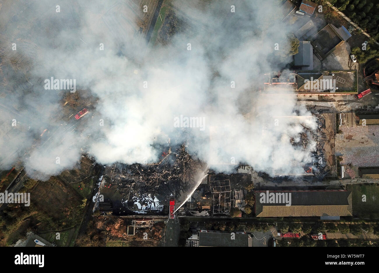 Aerial view of Asia's tallest wood pagoda burnt in fire at Jiulong ...