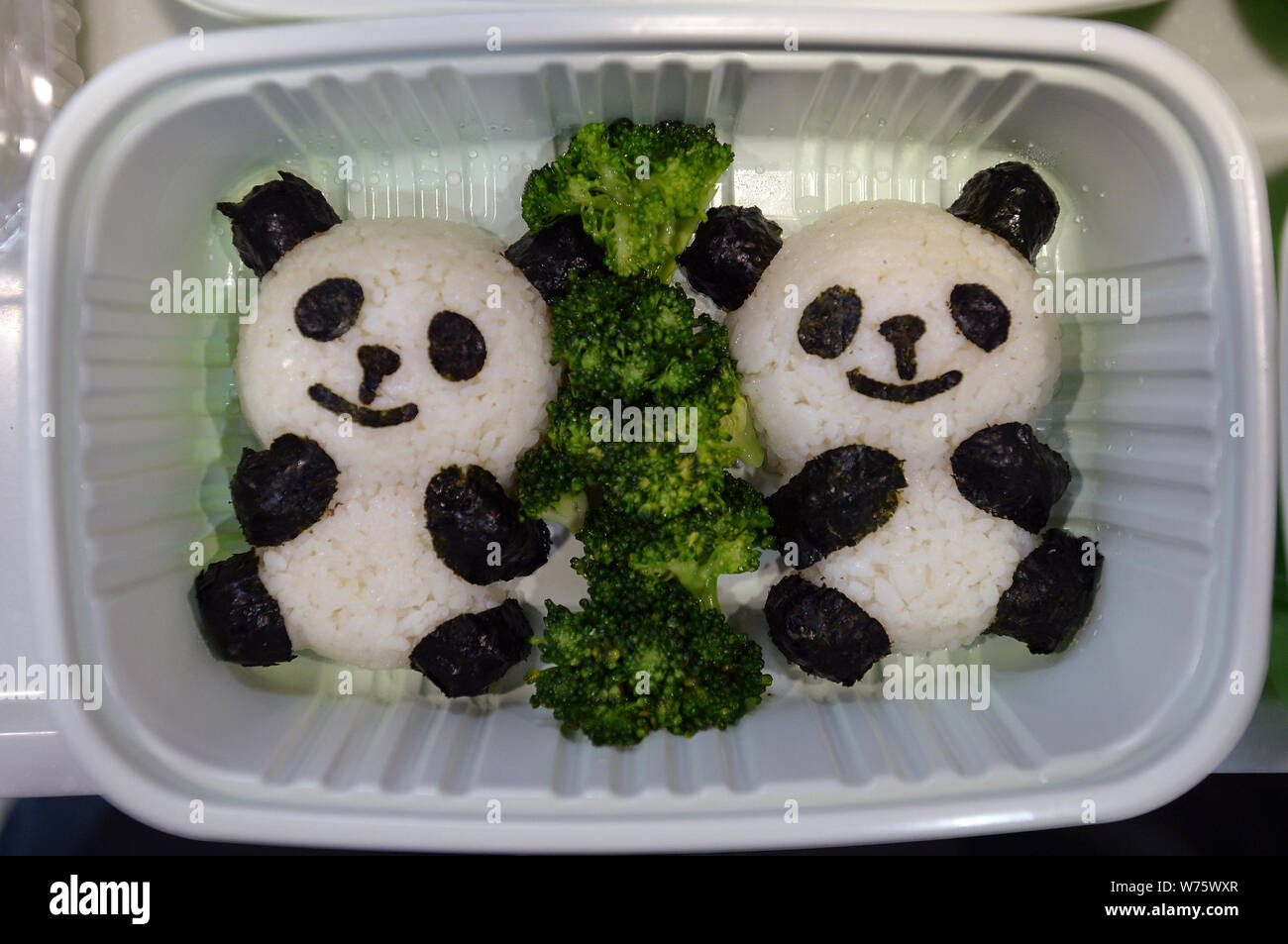 A box lunch featuring giant panda-shaped rice balls is offered in a CRH ...
