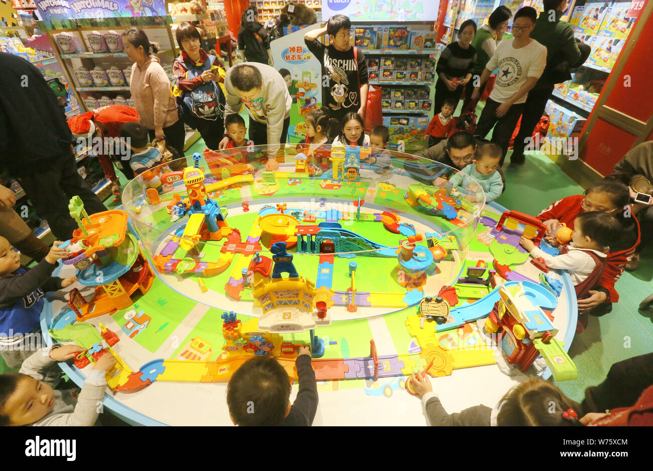 Customers crowd the newly-opened flagship store of British toy retailer ...