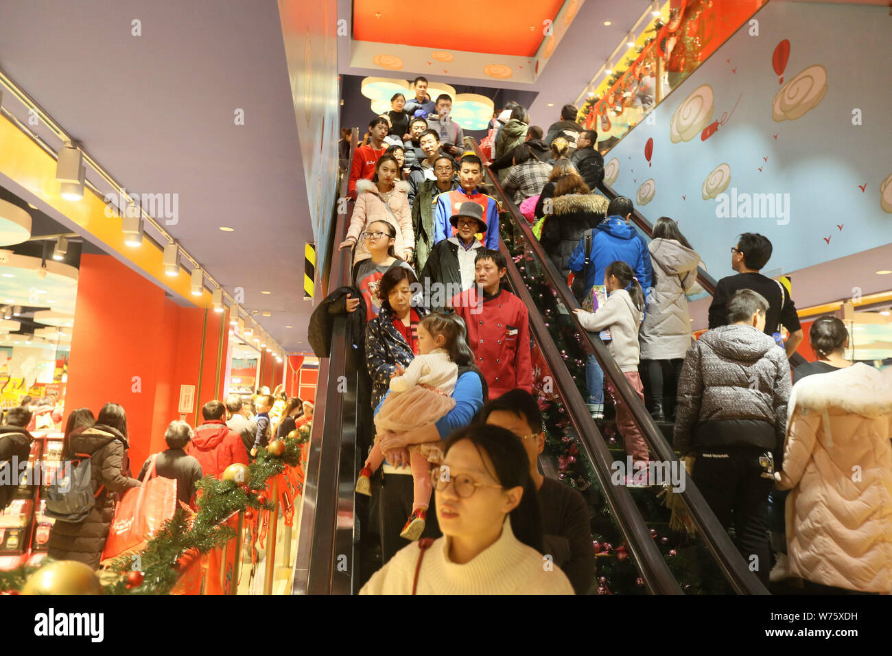 Customers crowd the newly-opened flagship store of British toy retailer ...
