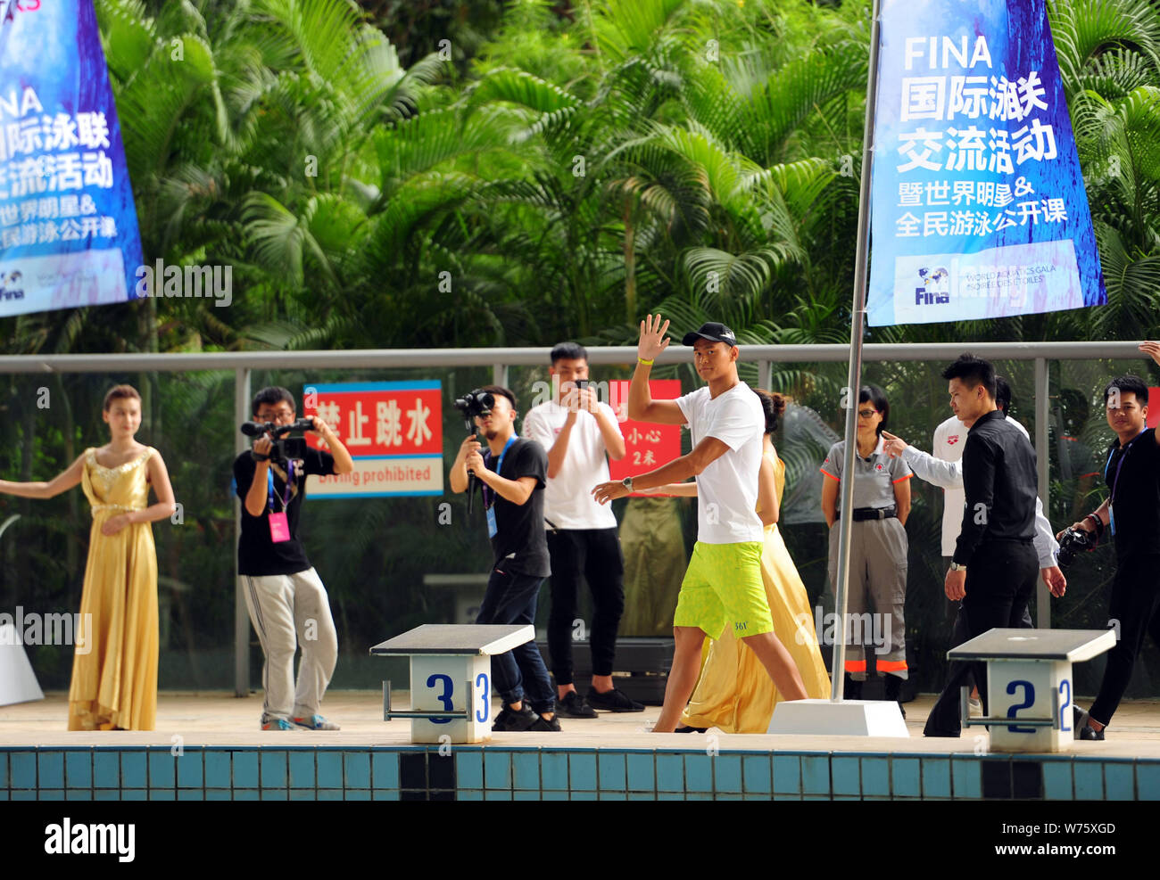 Chinese swimming star Sun Yang attends an open class in a swimming pool ...