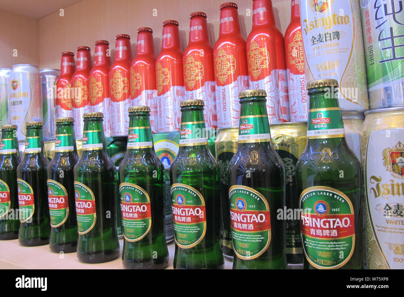 --FILE--Bottles of Tsingtao Beer of Tsingtao Brewery are on display at ...