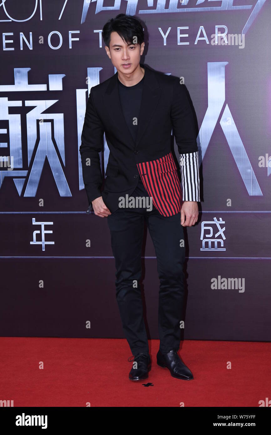 Bruneian singer and actor Wu Chun poses as he arrives on the red carpet ...