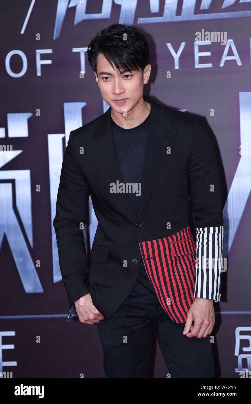 Bruneian singer and actor Wu Chun poses as he arrives on the red carpet ...