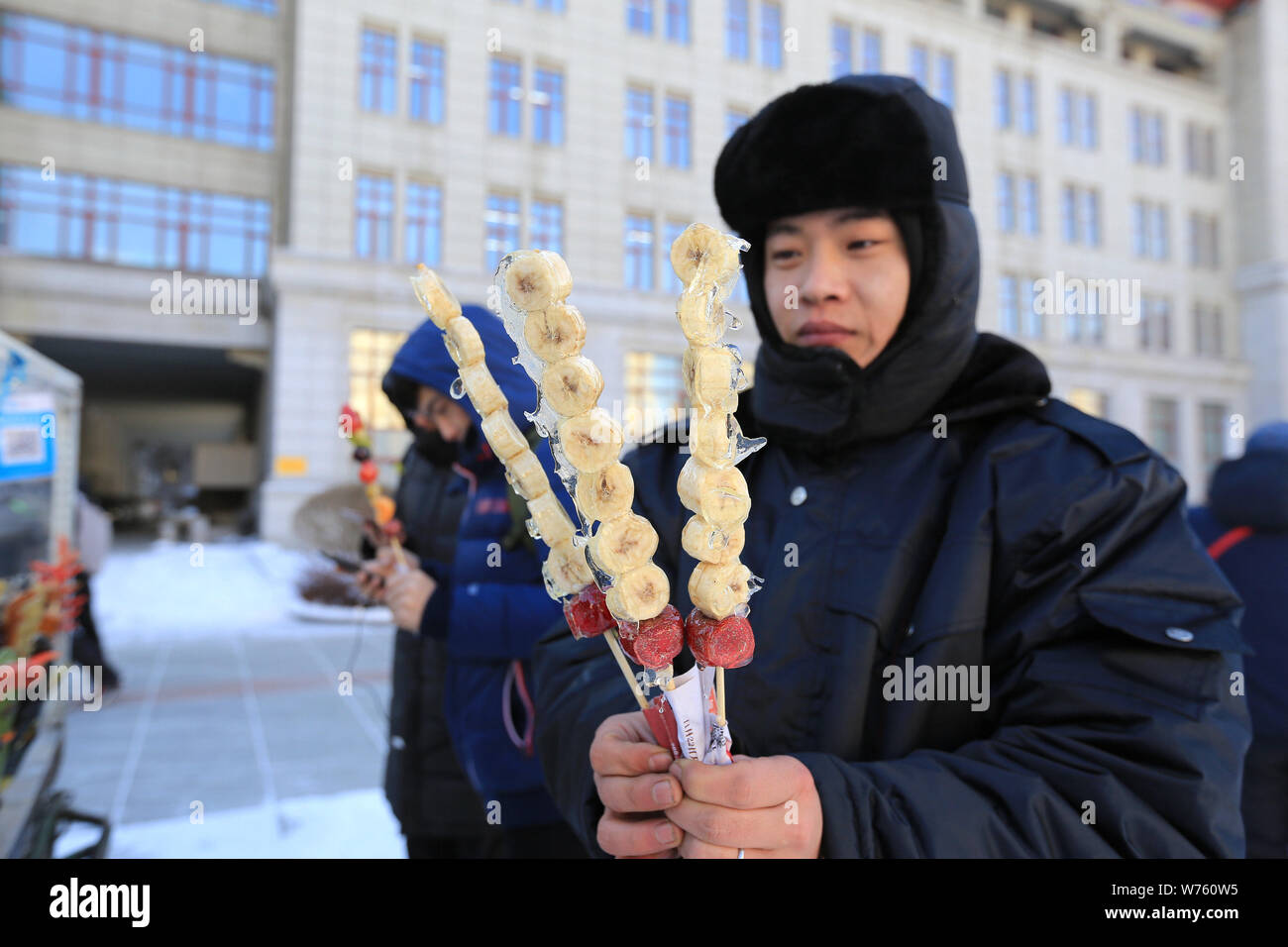 Chinese man Wang Jianyu shows unique tanghulu, also called bingtanghulu ...