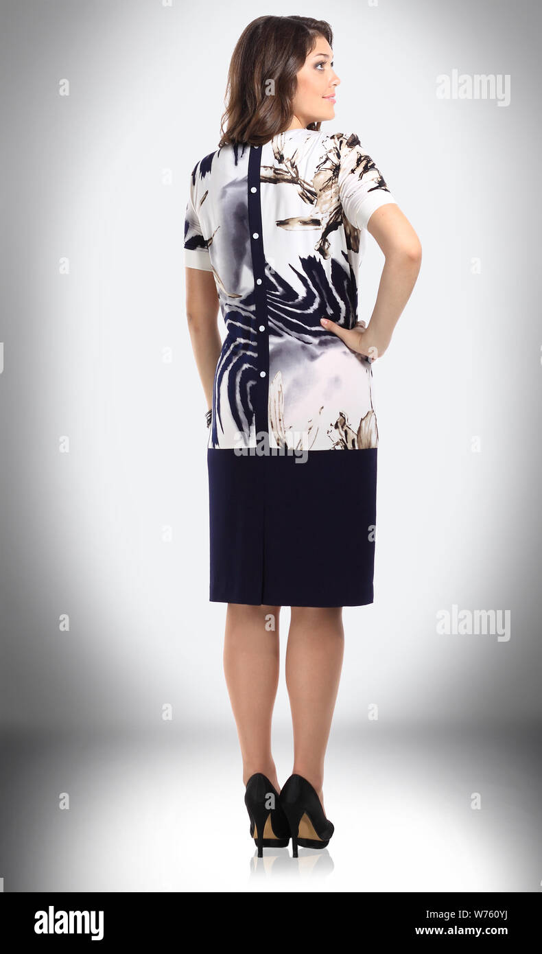 rear view. fashionable young business woman in a beautiful summer suit ...