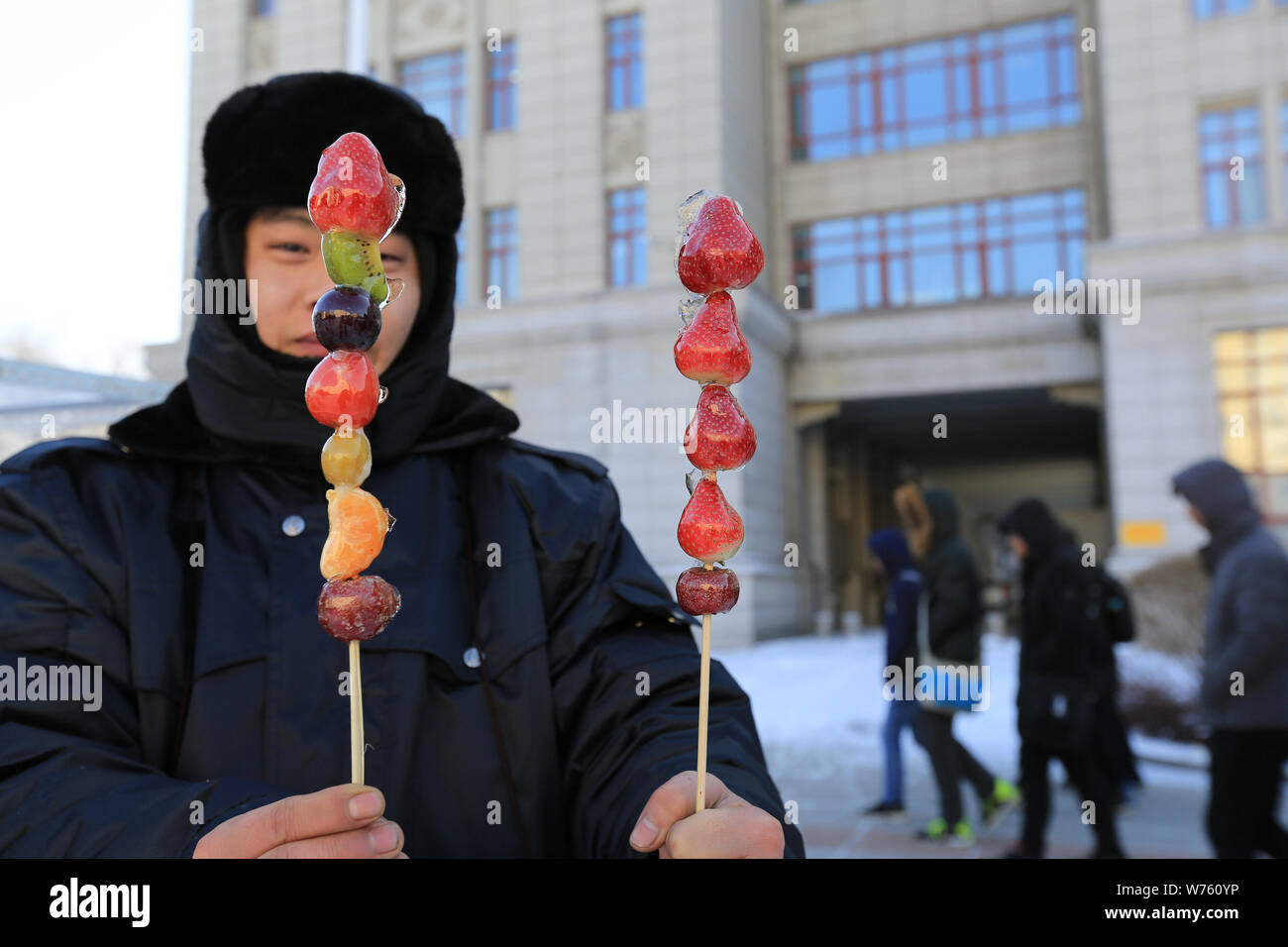 Chinese man Wang Jianyu shows unique tanghulu, also called bingtanghulu ...