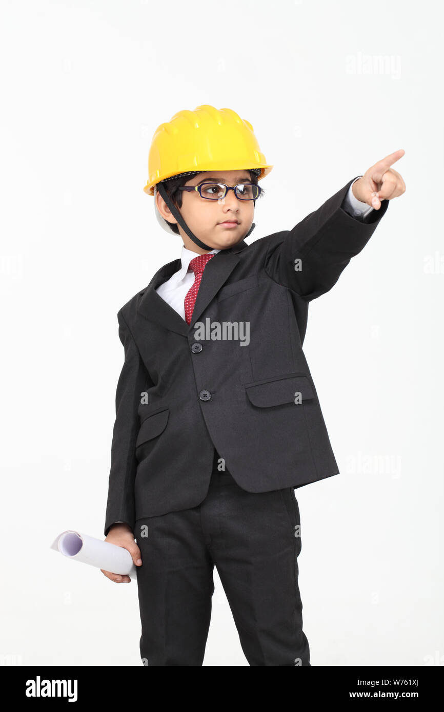 Boy pretending to be an architect and pointing Stock Photo - Alamy