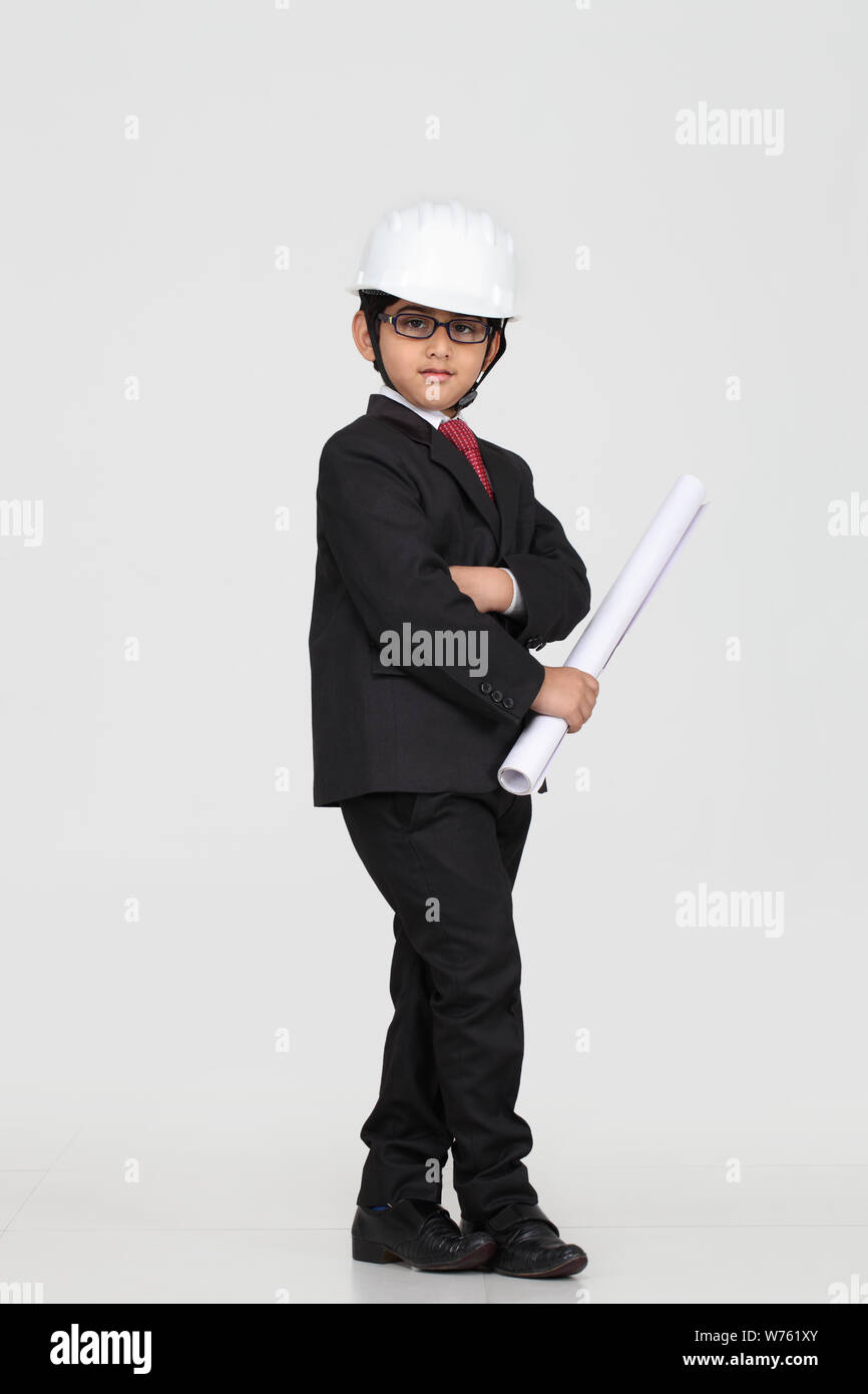 Boy pretending to be an architect and holding a blueprint Stock Photo ...